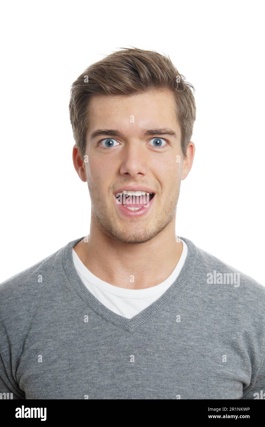 Young man looks surprised Stock Photo - Alamy