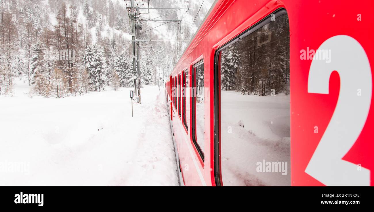 A red train in the middle of a desert of snow Stock Photo - Alamy