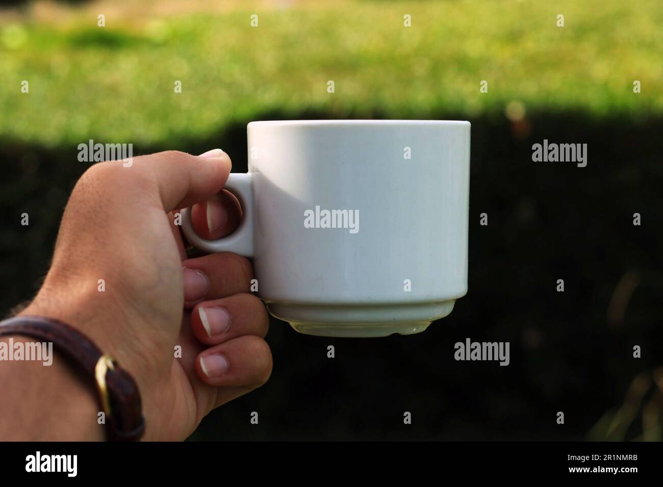 Picking up cup hi-res stock photography and images - Alamy