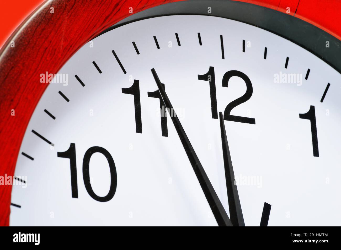 Wall clock showing five to twelve Stock Photo - Alamy