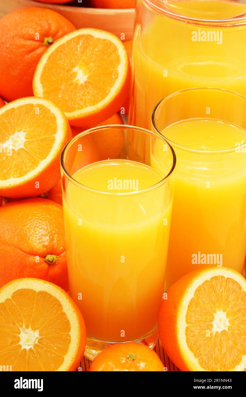 Composition with glasses of orange juice and fruits Stock Photo - Alamy