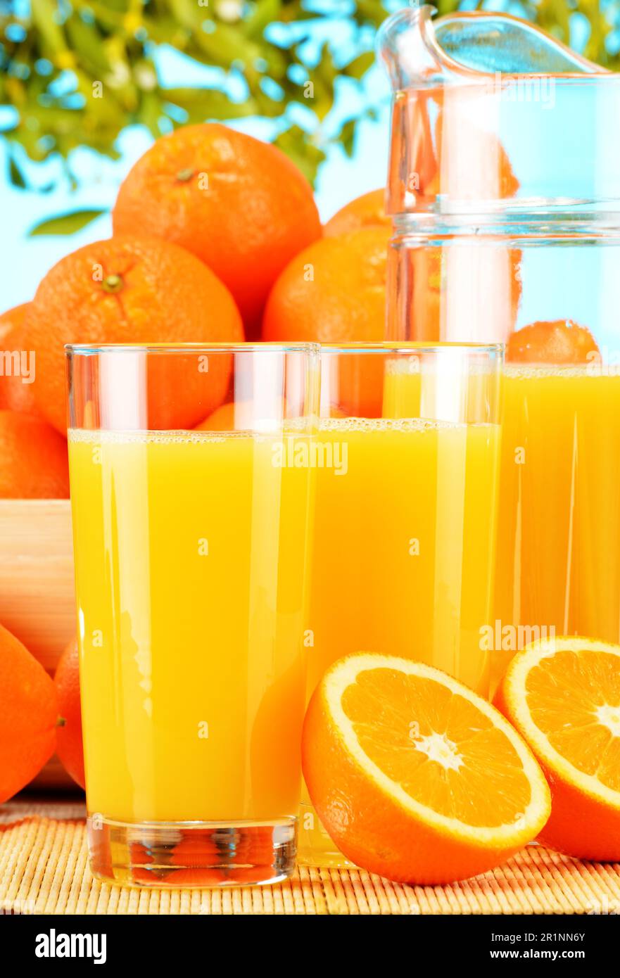 Composition with glasses of orange juice and fruits Stock Photo - Alamy