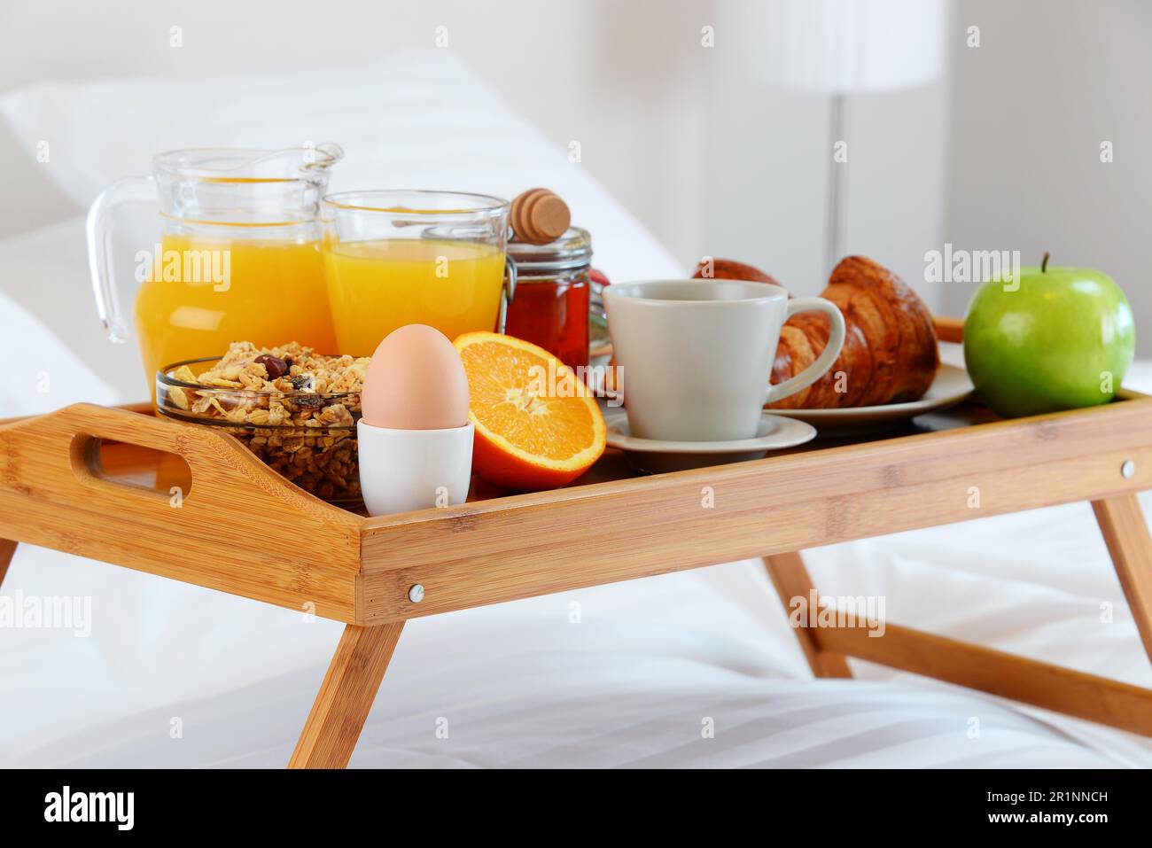 Breakfast in bed in hotel room. Accommodation Stock Photo - Alamy