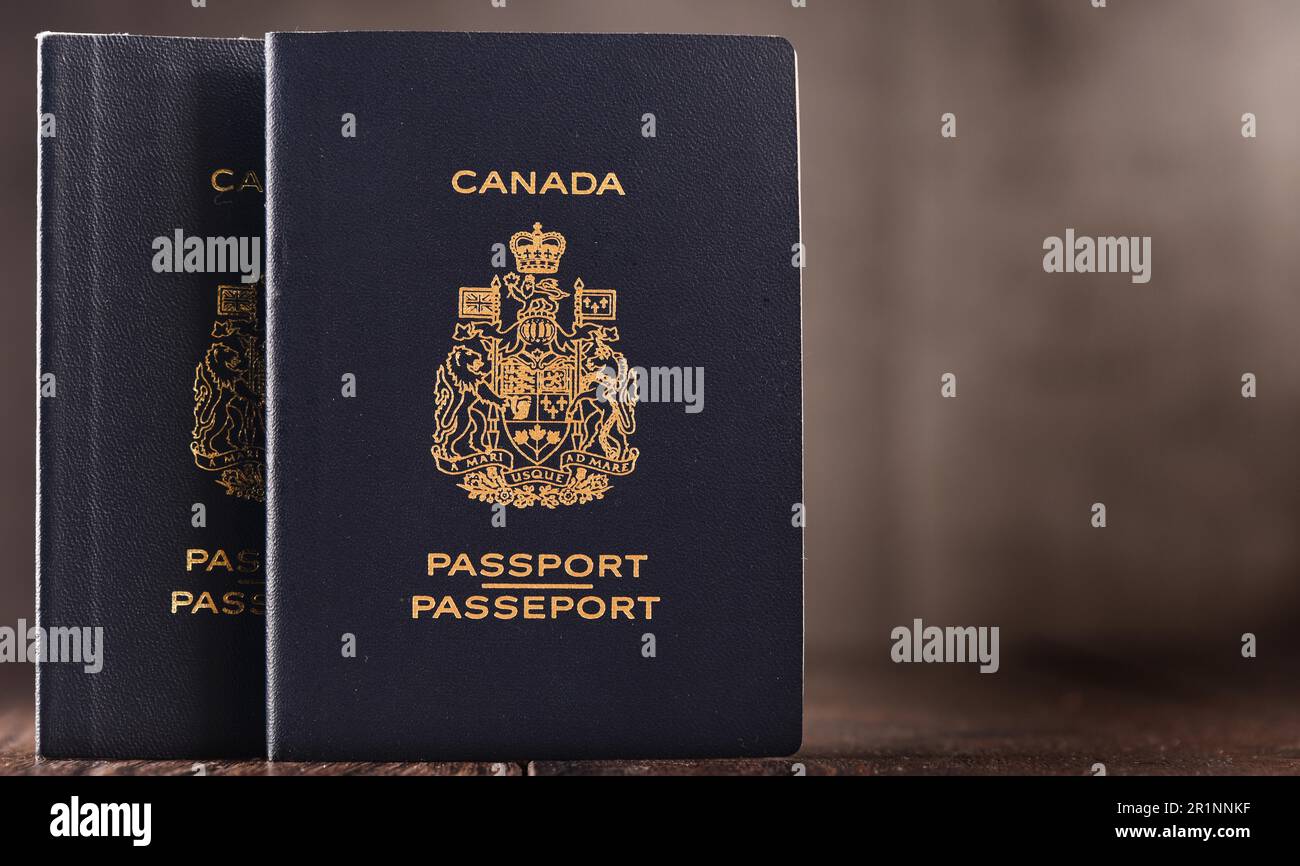 Composition with two Canadian passports Stock Photo - Alamy