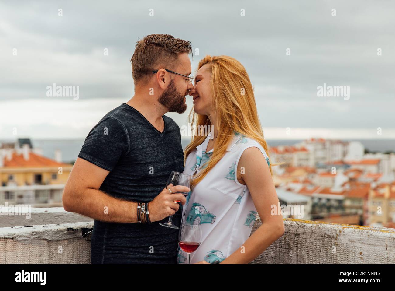 Affectionate Couple on a Rooftop Stock Photo - Alamy