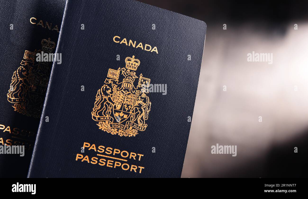Composition with two Canadian passports Stock Photo - Alamy