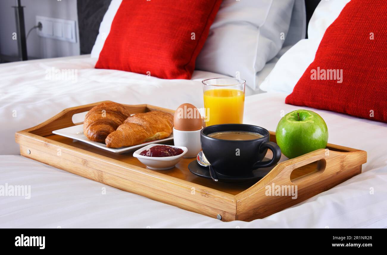 Breakfast on tray in bed in hotel room Stock Photo - Alamy