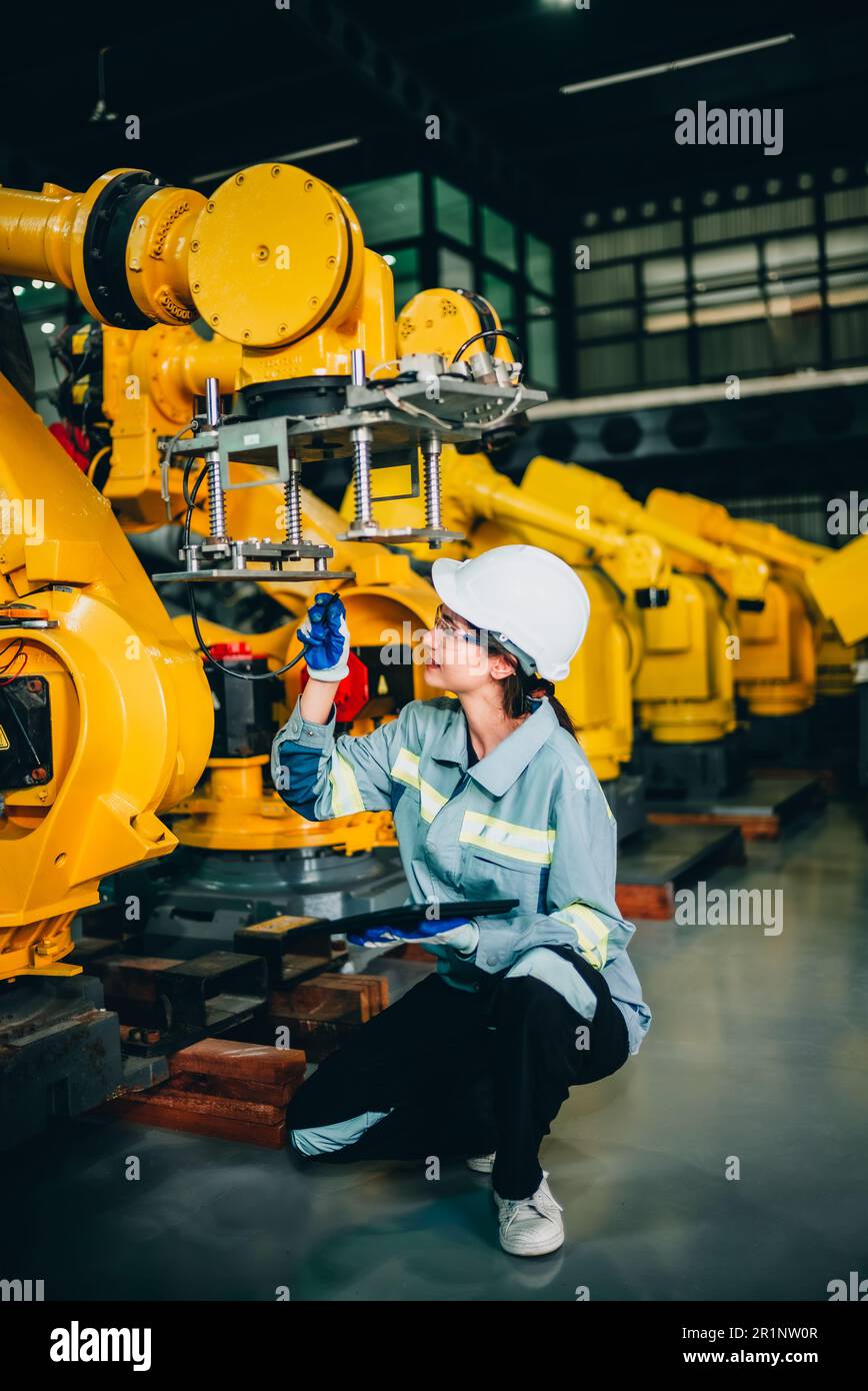 Robotic engineer conduct regular maintenance by inspecting, testing ...