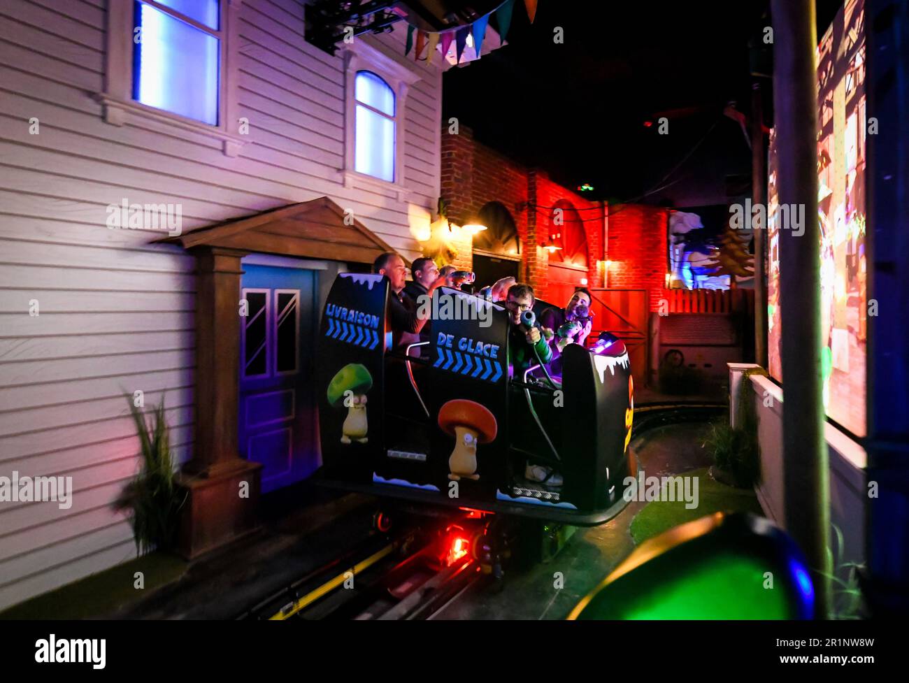 People try out the "Champi'folies' dark ride at Le Pal in France Stock ...