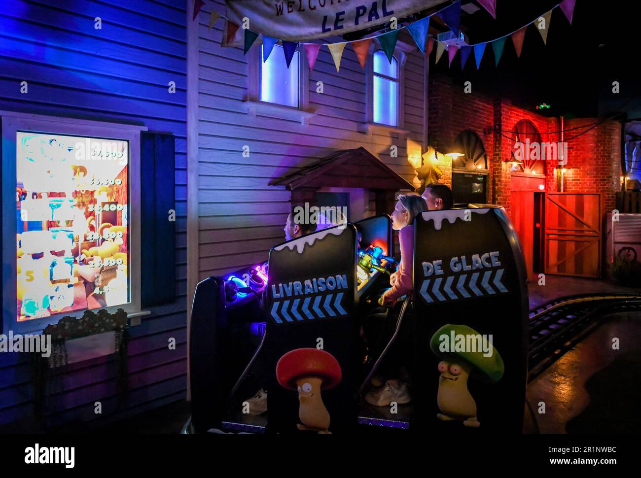 People try out the "Champi'folies' dark ride at Le Pal in France Stock ...