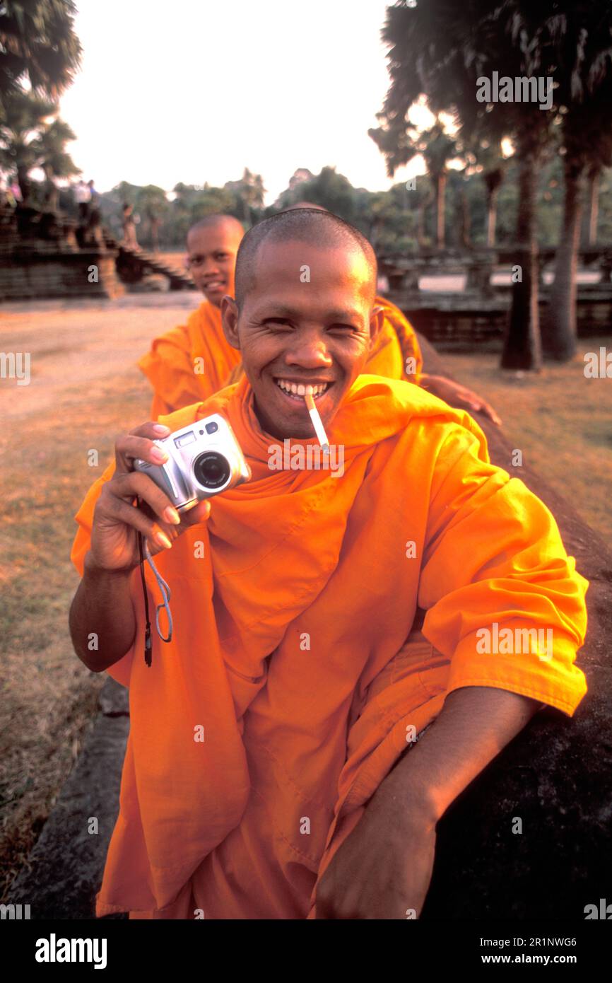 Monks with Camera and Cigarette at World's Largest Temple Angkor Wat ...