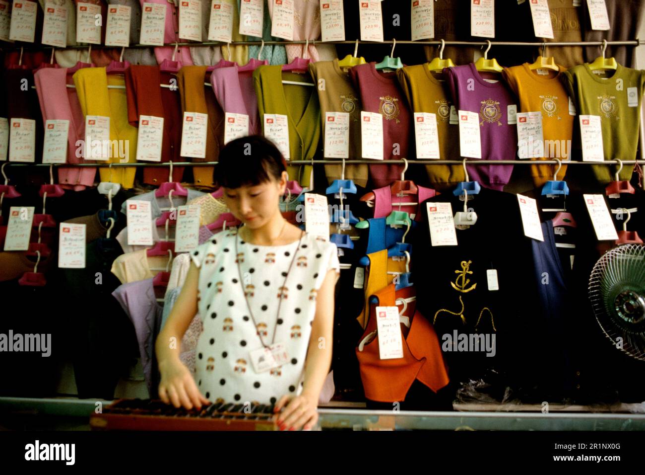 Sales lady using abacus in a local shop of Beijing China Stock Photo ...