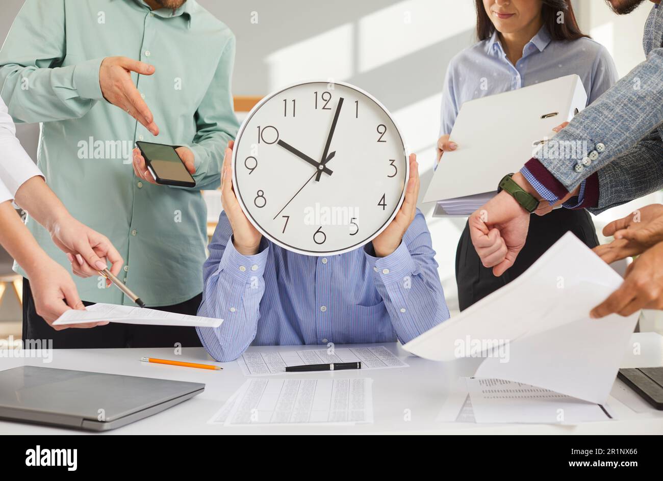 Busy stressed office worker with clock face is asked to do lots of ...