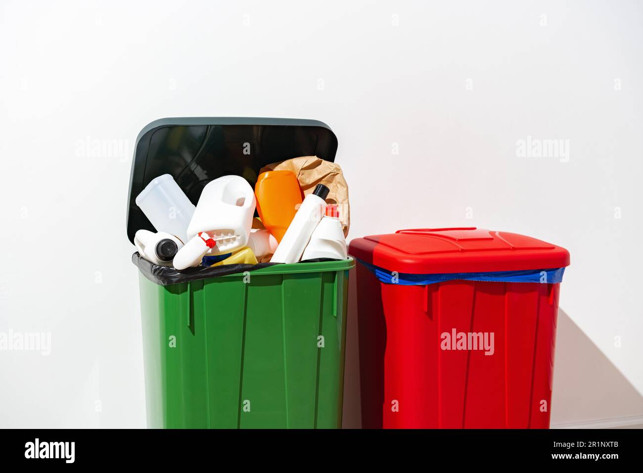 Trash cans full of waste in the building Stock Photo - Alamy