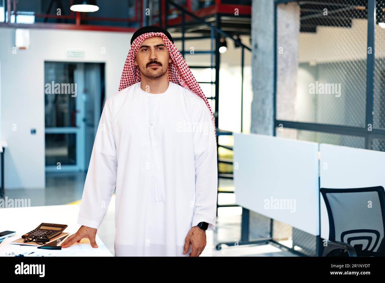 Successful muslim businessmen in traditional outfit in his office Stock ...