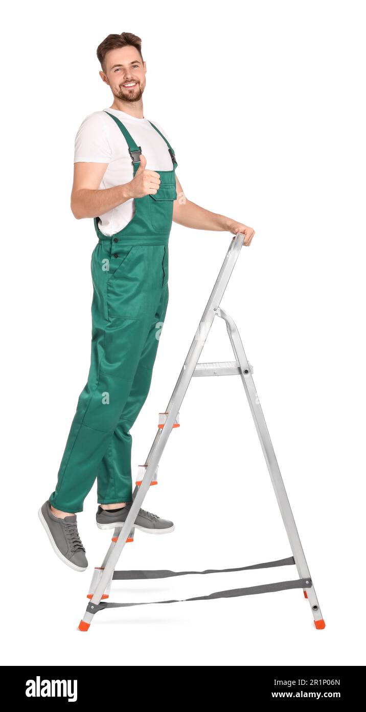 Worker in uniform climbing up metal ladder on white background Stock ...