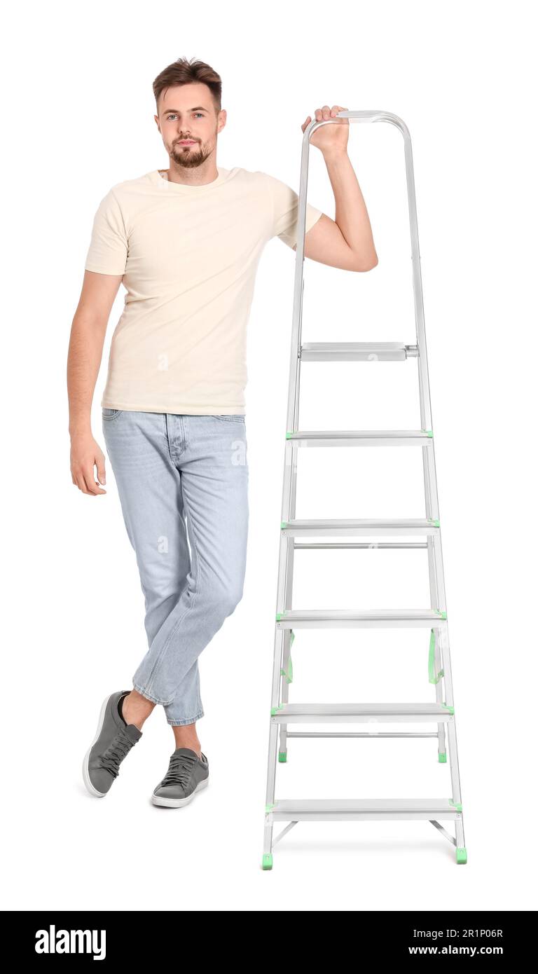 Young handsome man near metal ladder on white background Stock Photo ...
