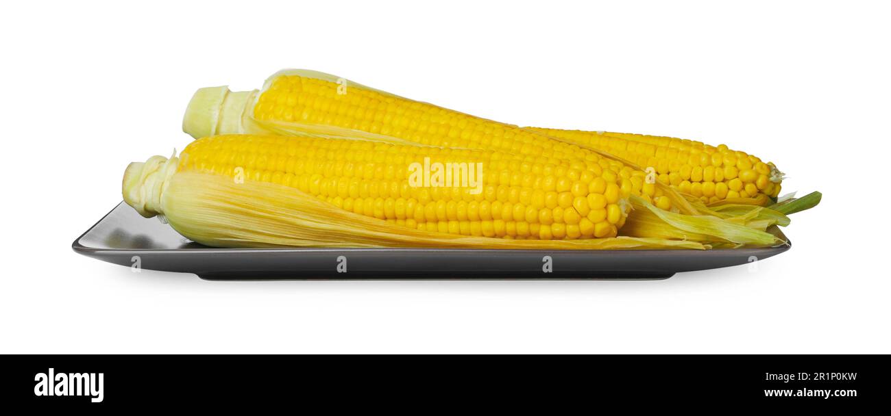 Plate with tasty cooked corn cobs on white background Stock Photo - Alamy