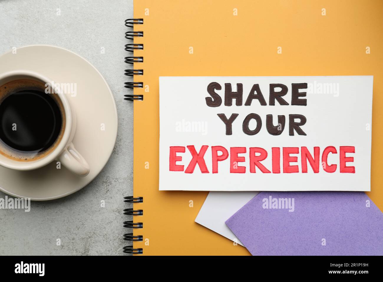 Share Your Experience. Notebook with paper notes and coffee on light ...