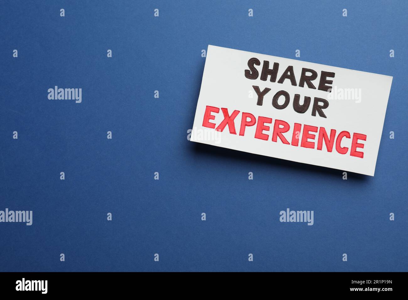 Card with motivational phrase Share Your Experience on blue background ...