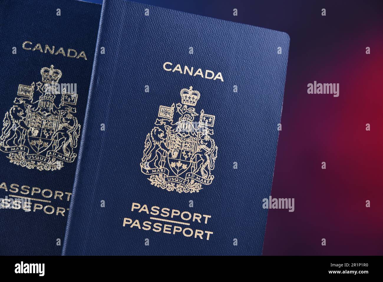 Composition with two Canadian passports Stock Photo - Alamy