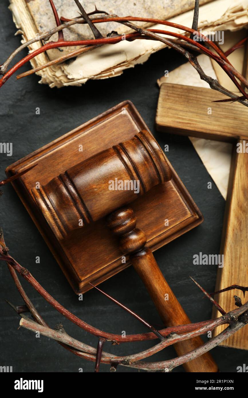 Judge gavel, wooden cross and crown of thorns on black table, flat lay ...
