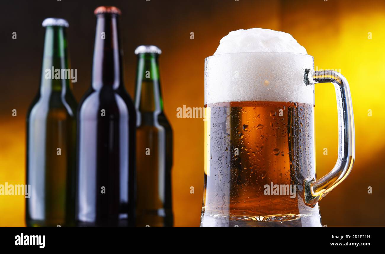 Composition with glass and bottles of beer Stock Photo - Alamy