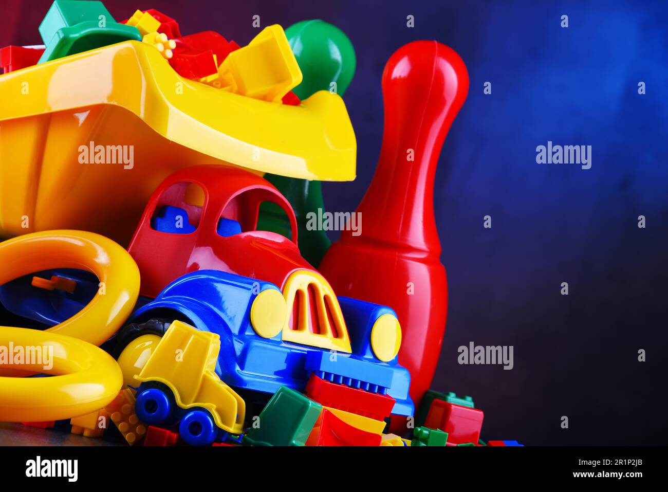 Composition with colorful plastic children toys Stock Photo - Alamy