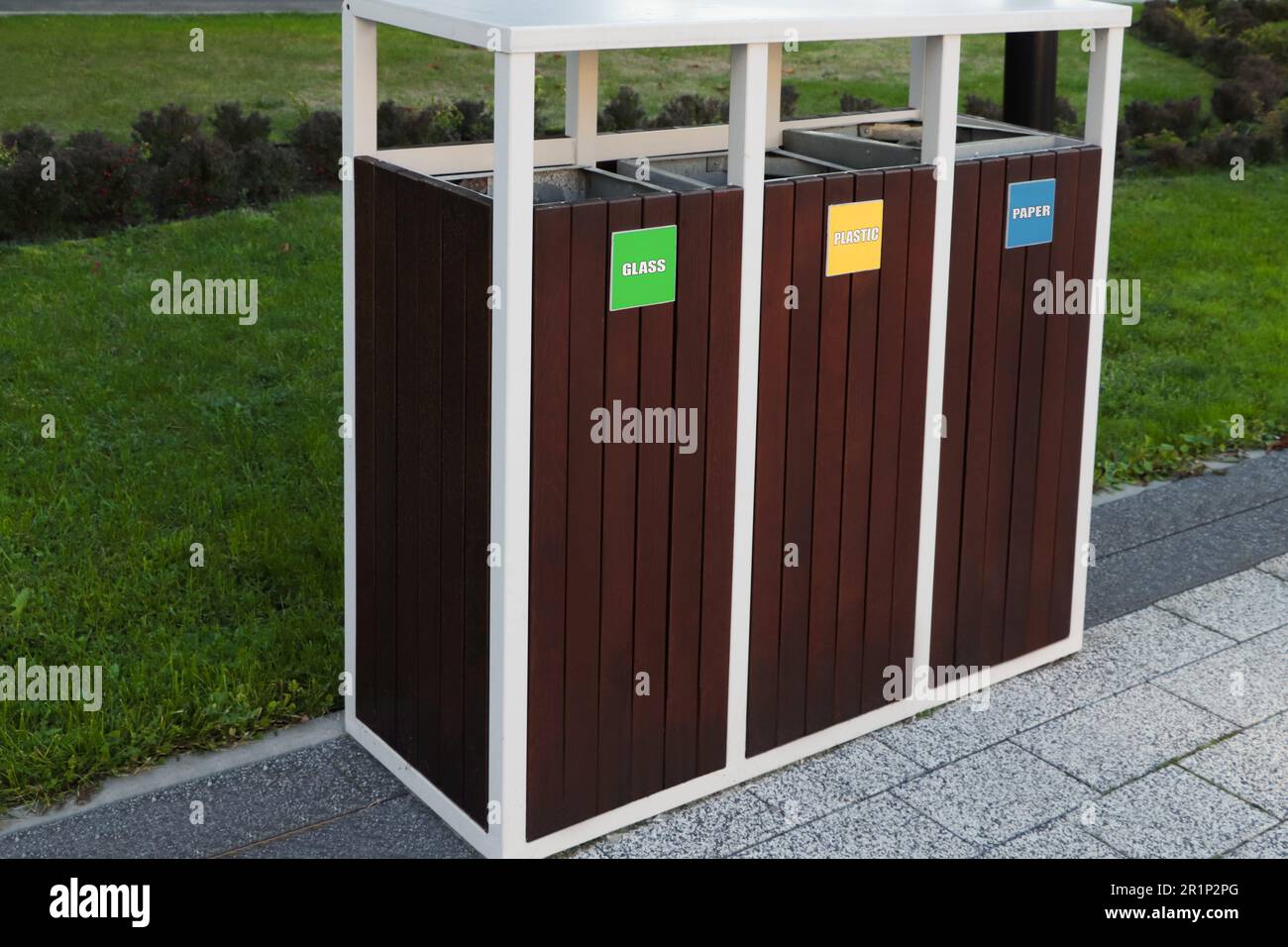 Different sorting bins for waste recycling outdoors Stock Photo - Alamy