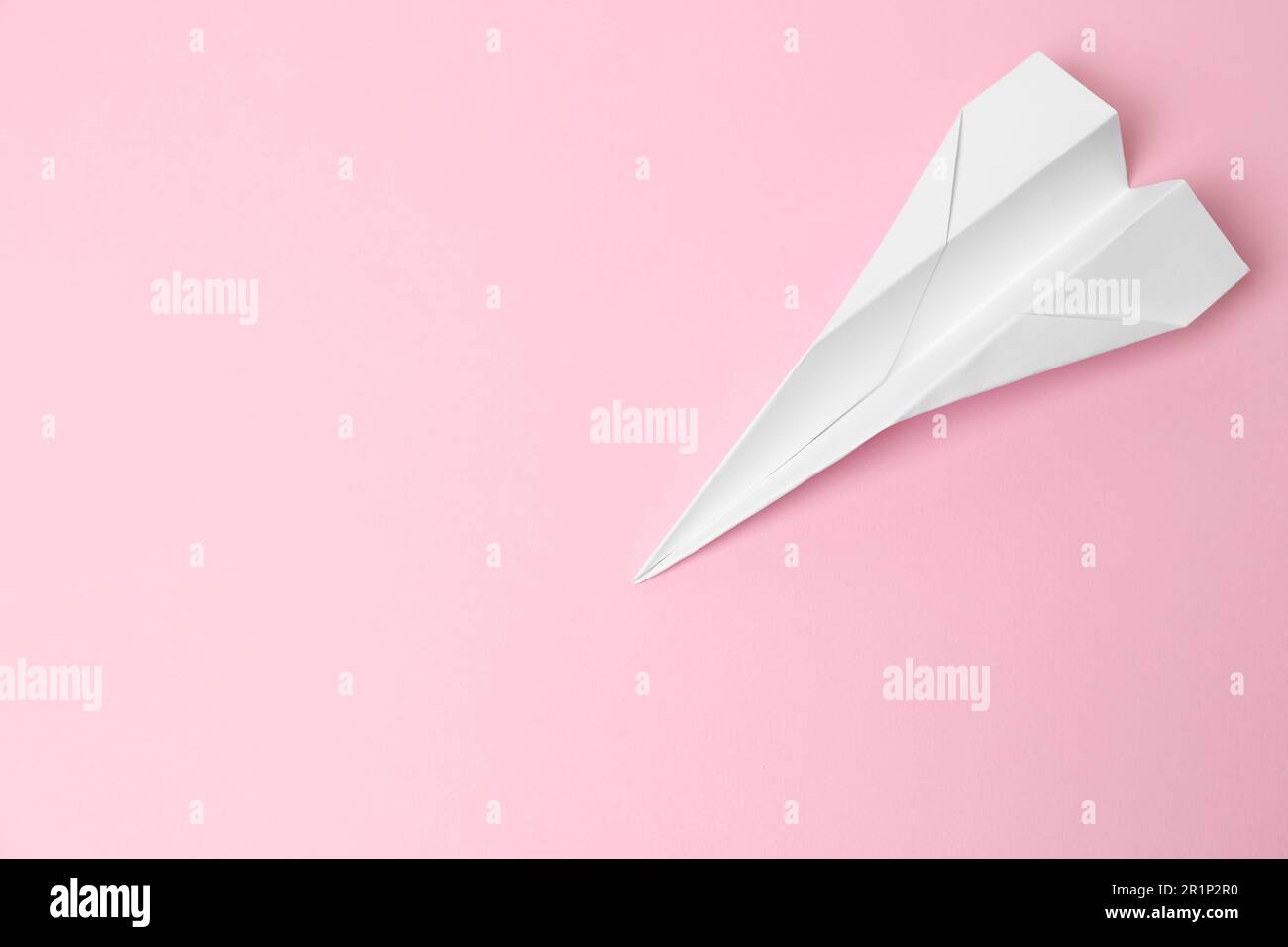 Handmade paper plane on pink background, top view. Space for text Stock ...