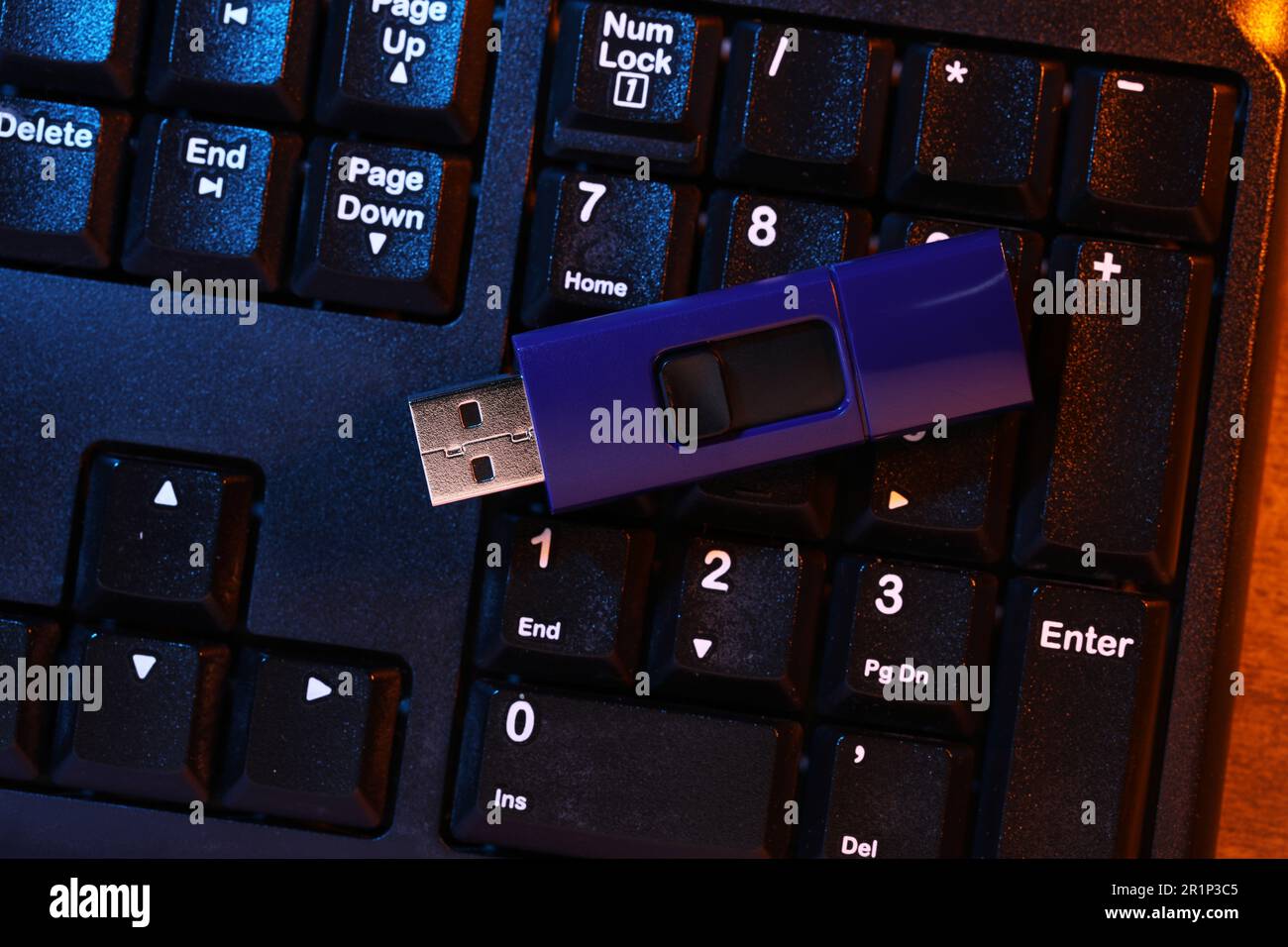Modern usb flash drive on computer keyboard, top view Stock Photo - Alamy