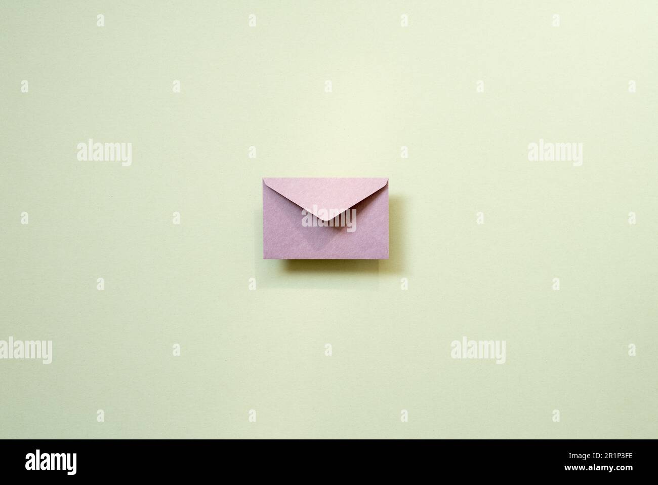 Purple envelope isolated on mint background. anniversary, valentine ...