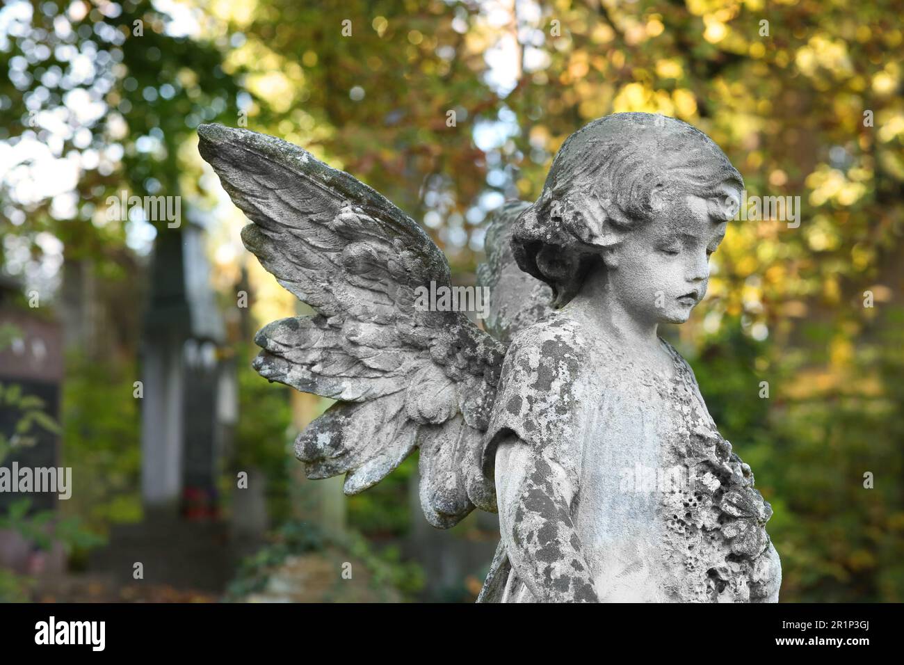 Beautiful statue of angel at cemetery. Religious symbol Stock Photo - Alamy