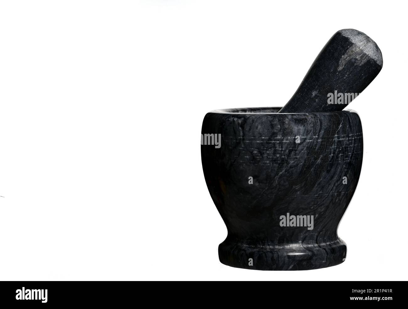 Close-up of a massive heavy dark stone jar with mortar grinder for ...