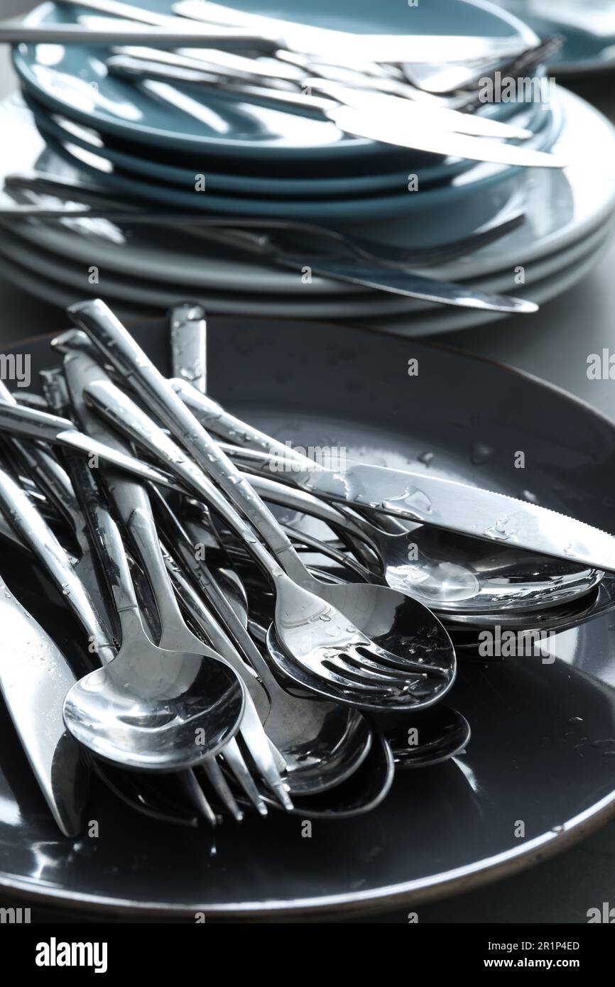 Different clean kitchenware on light grey table Stock Photo - Alamy