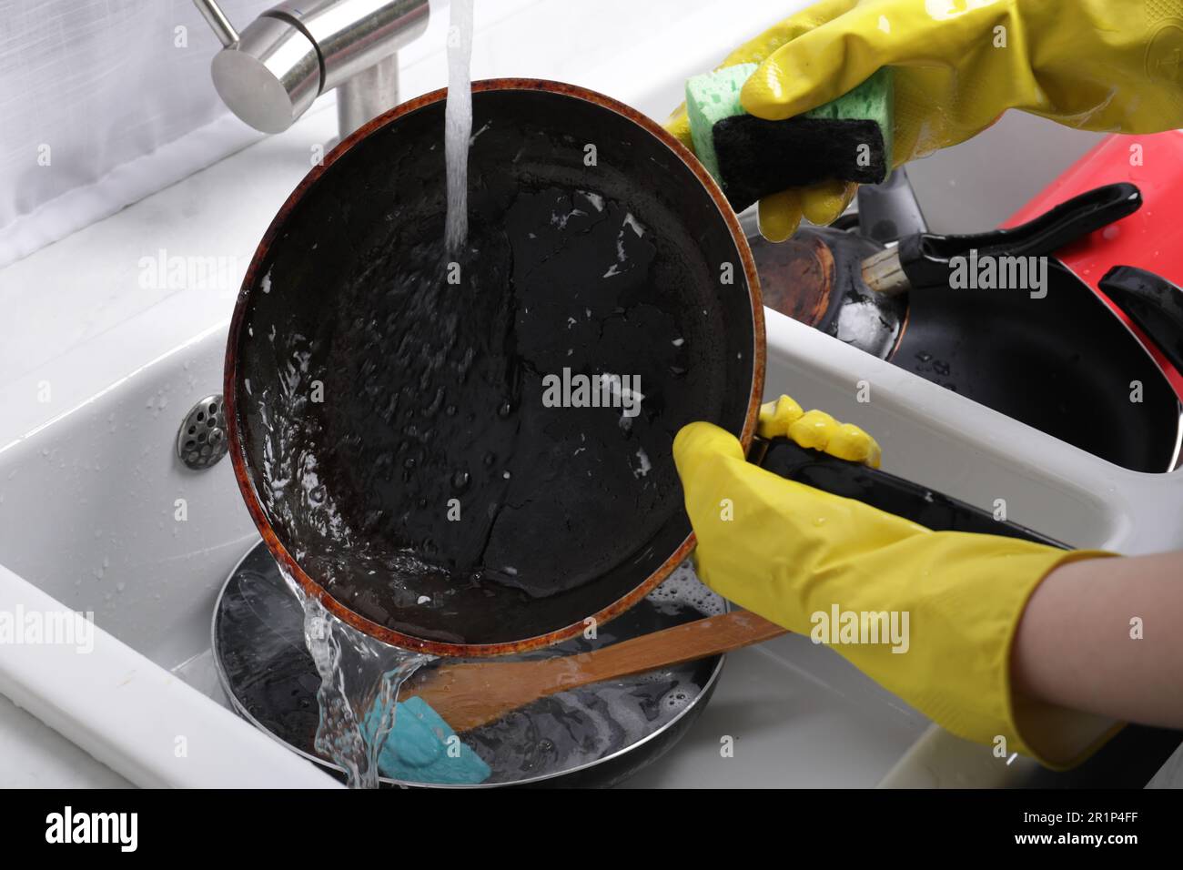 Woman cooking pot cleaning hi-res stock photography and images - Alamy