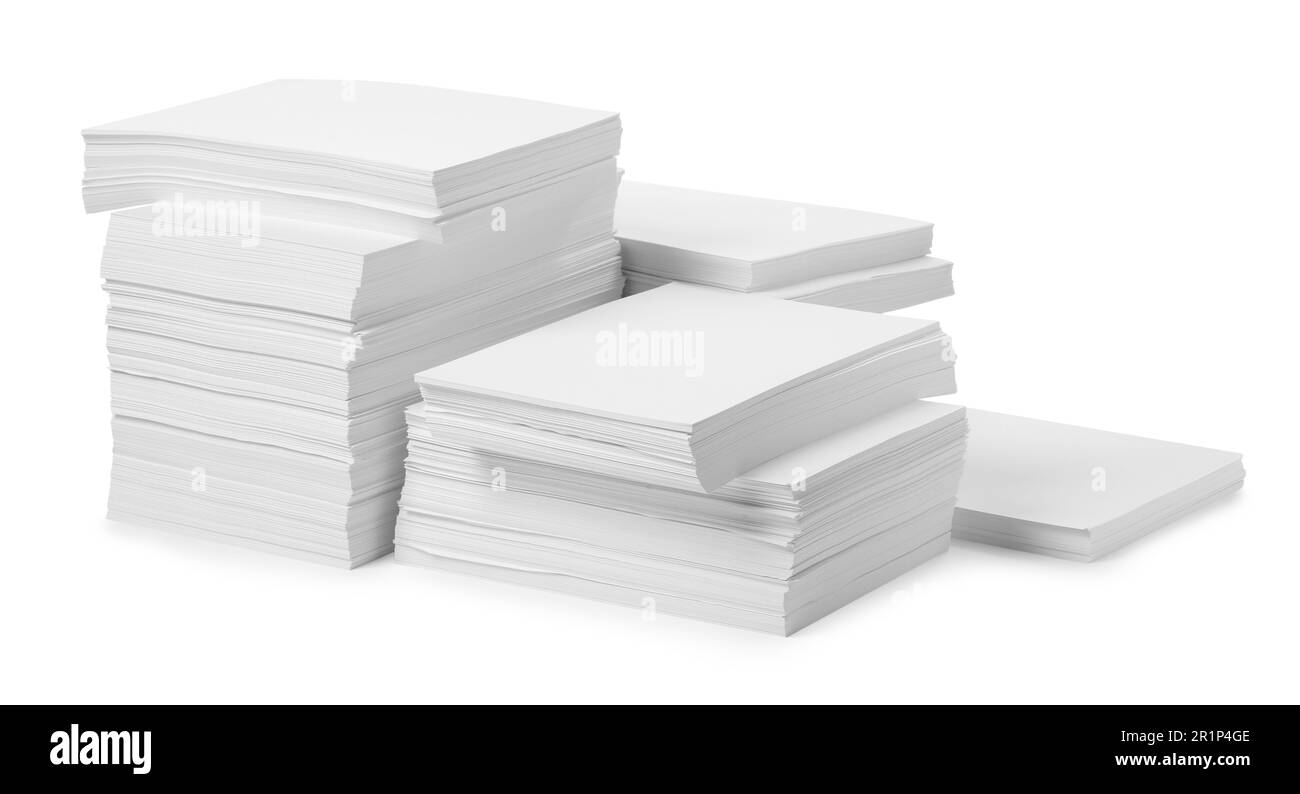 Stacks of paper sheets on white background Stock Photo - Alamy
