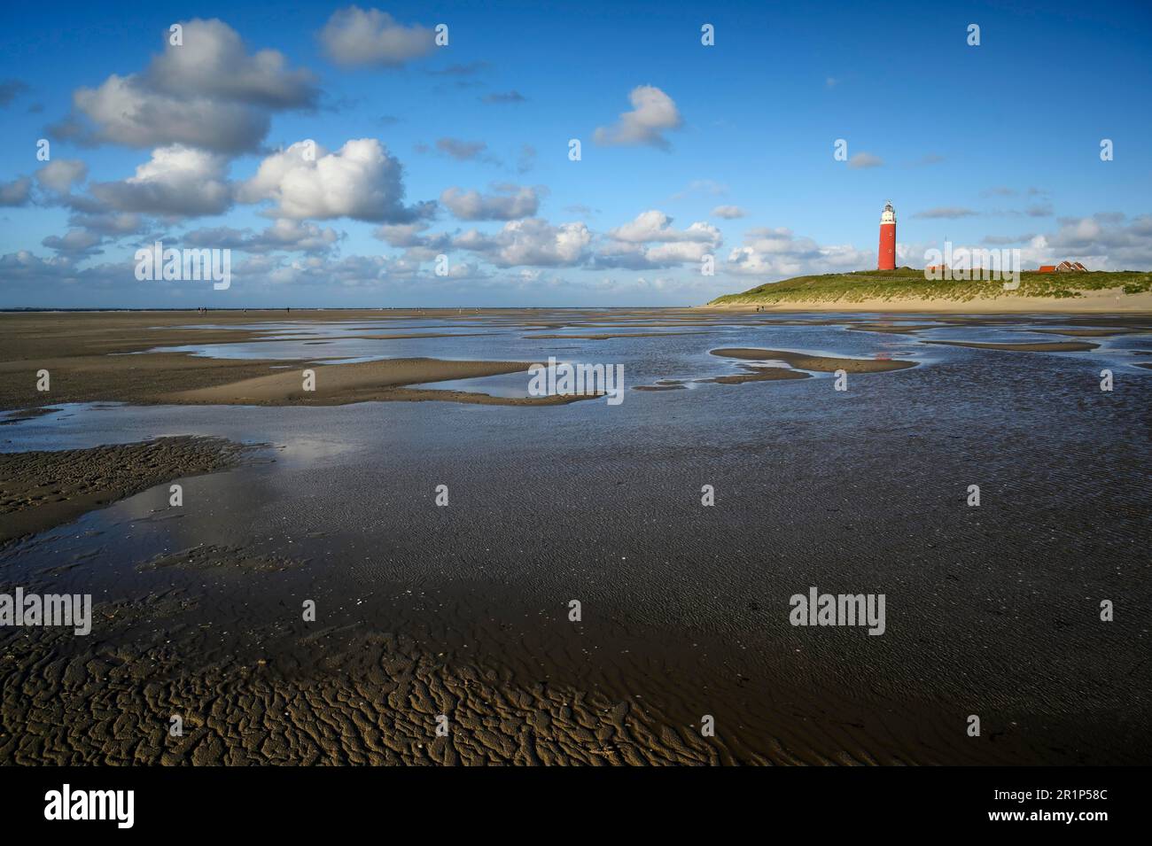 Lighthouse at the northern tip of Texel, with beach and tideways, Texel ...