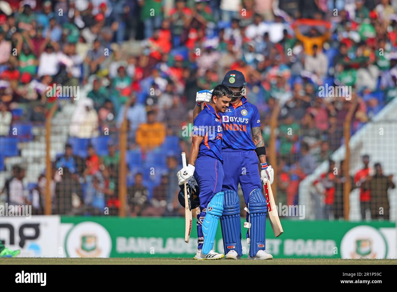 Indian batter Ishan Kishan celebrates his hundred runs along Virat ...