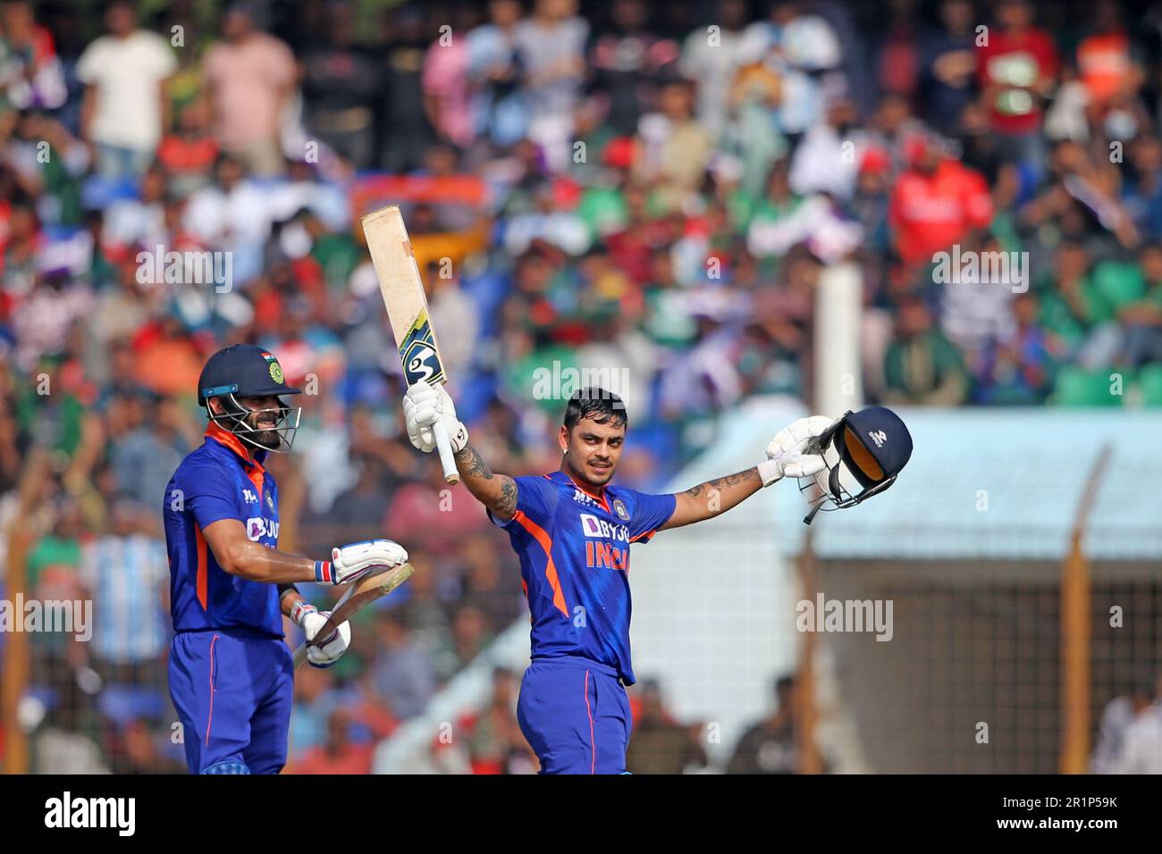 Indian batter Ishan Kishan celebrates his hundred runs along Virat ...