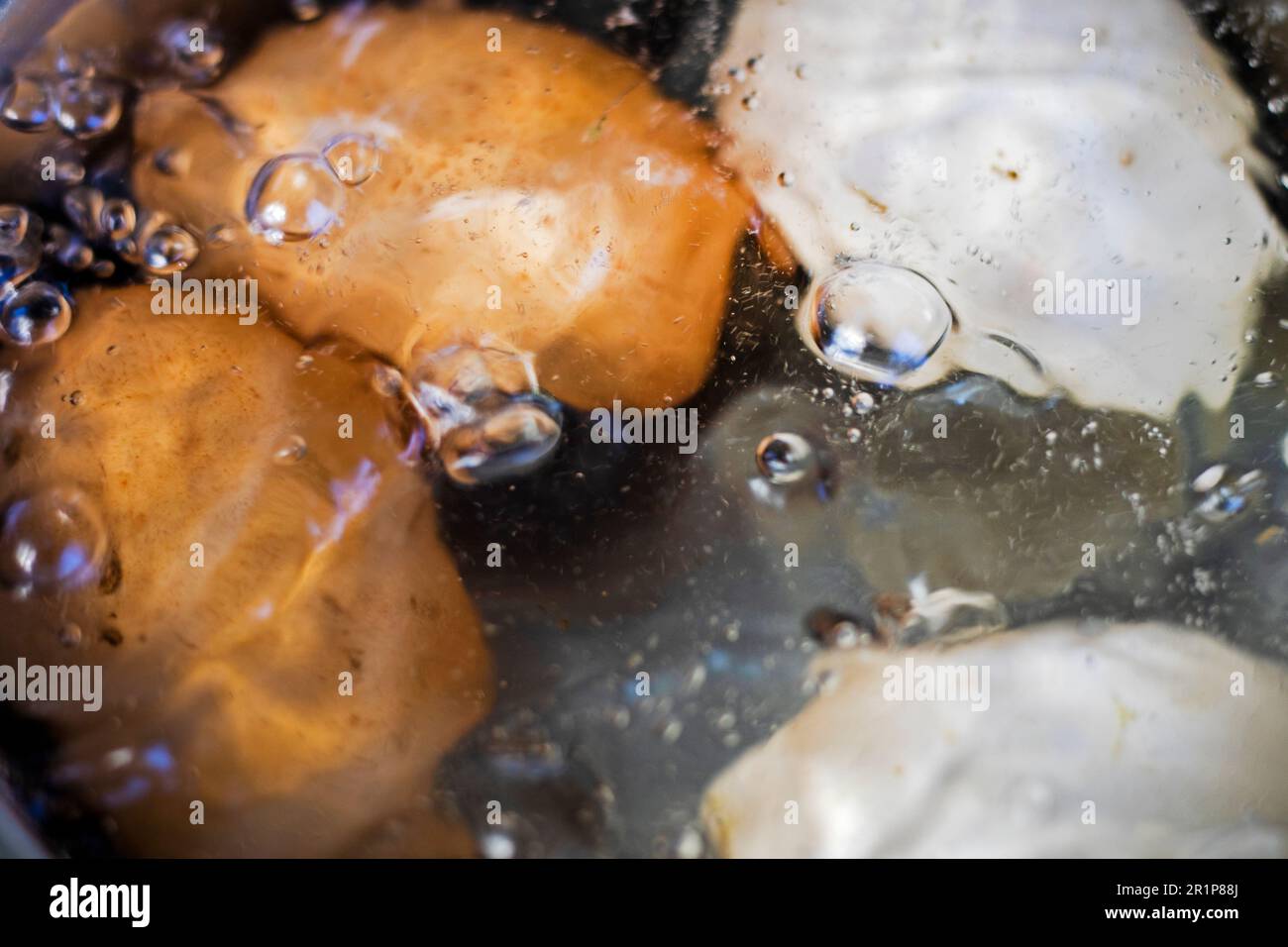 close-up boil eggs in a saucepan on the stove. egg cooking healthy ...