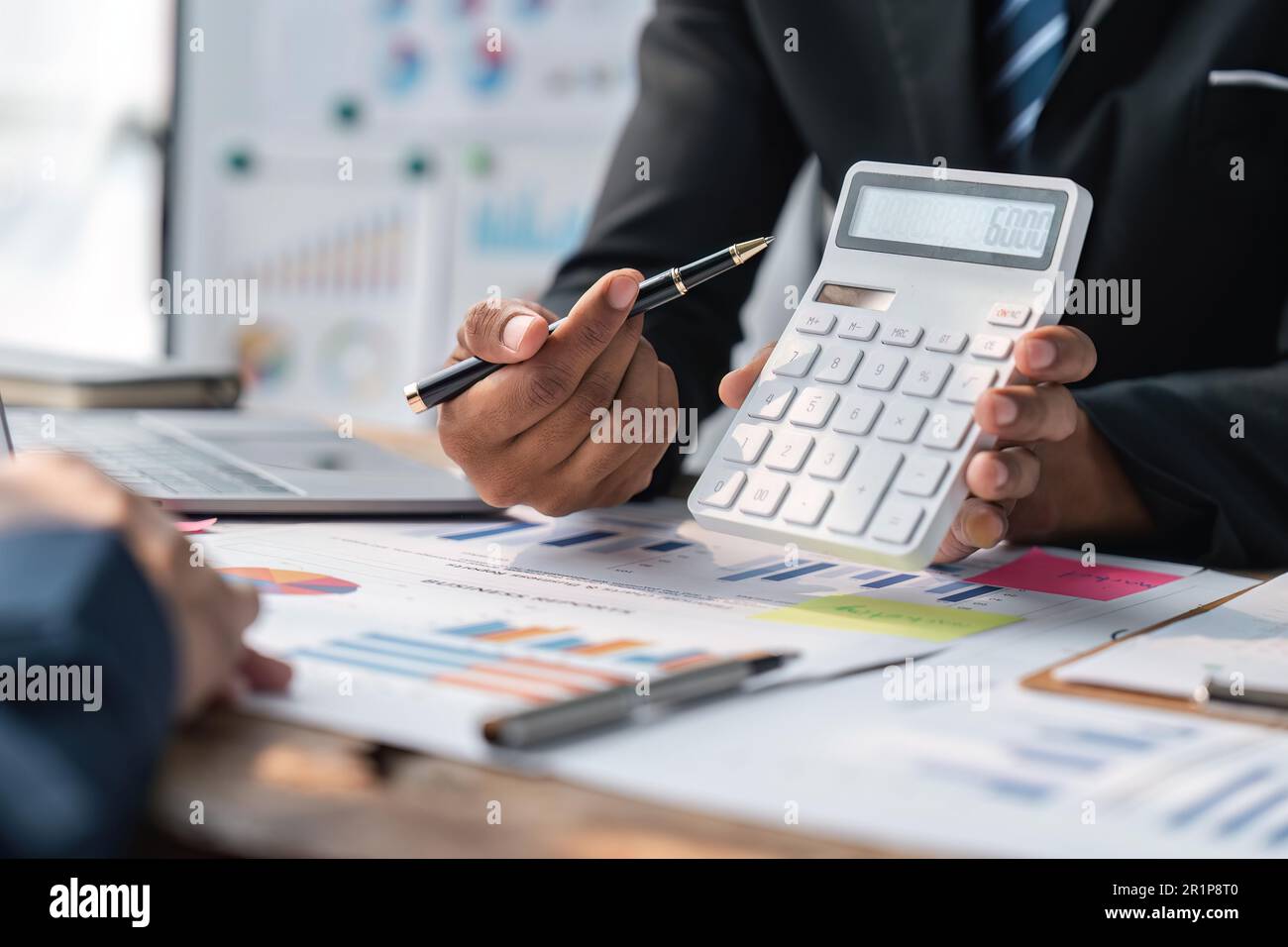 Meeting business team advisor about financial graph chart showing ...