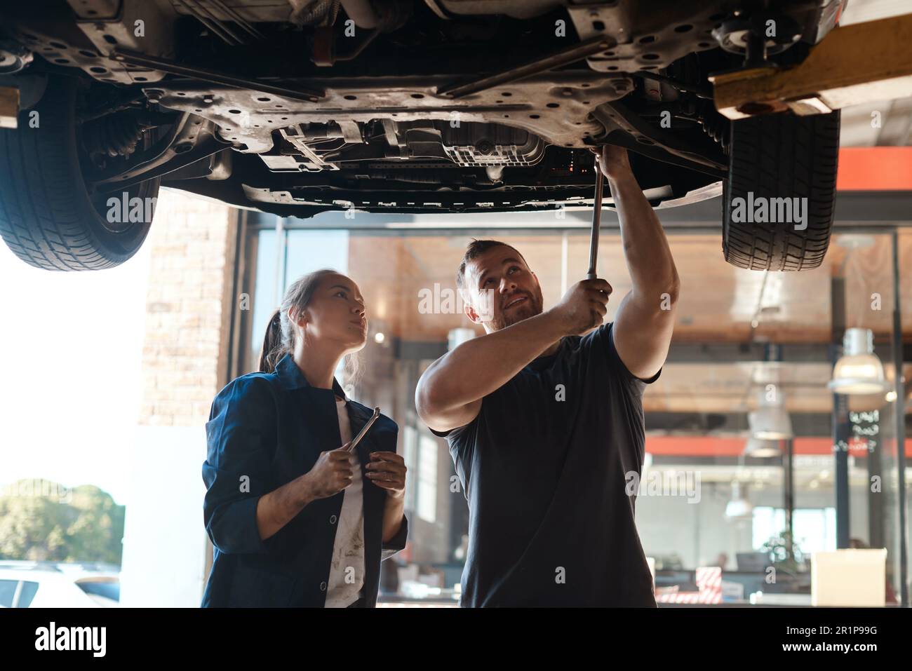 Well do a better job in half the time. two mechanics working together ...