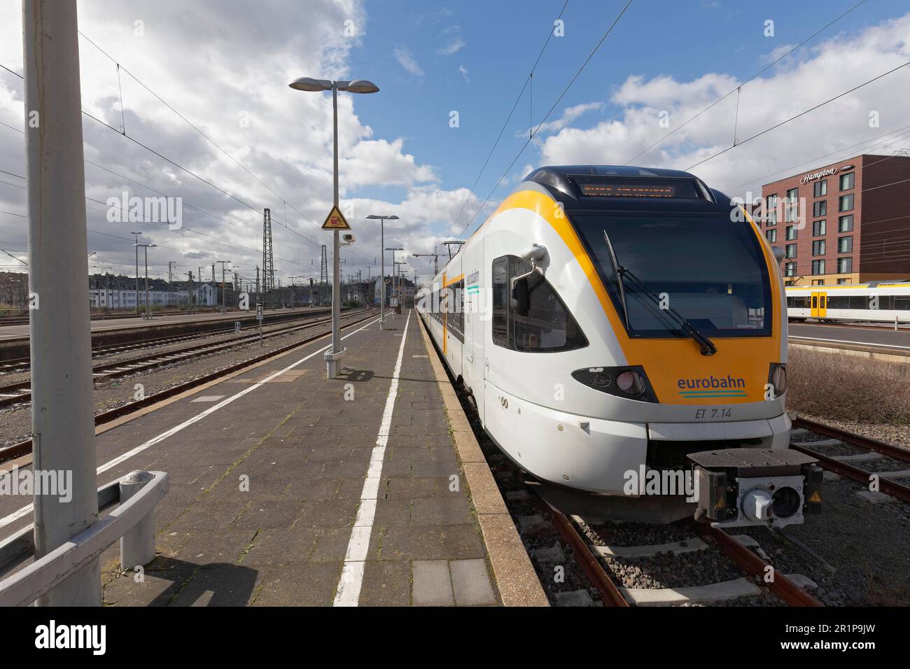 Eurobahn low-floor train stands at an empty platform, warning strike of ...