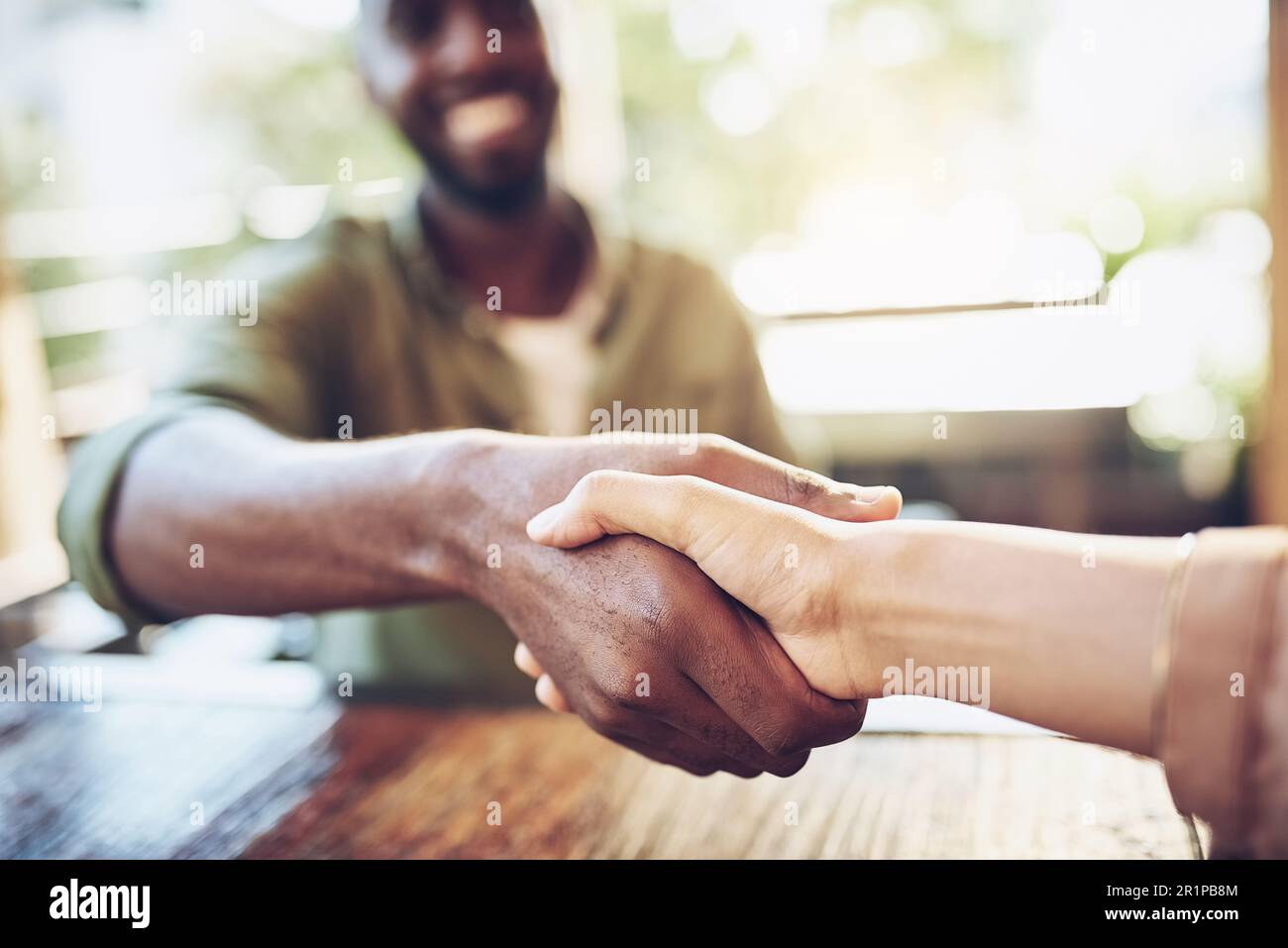 Shaking hands, people and coffee shop with remote work deal and thank ...