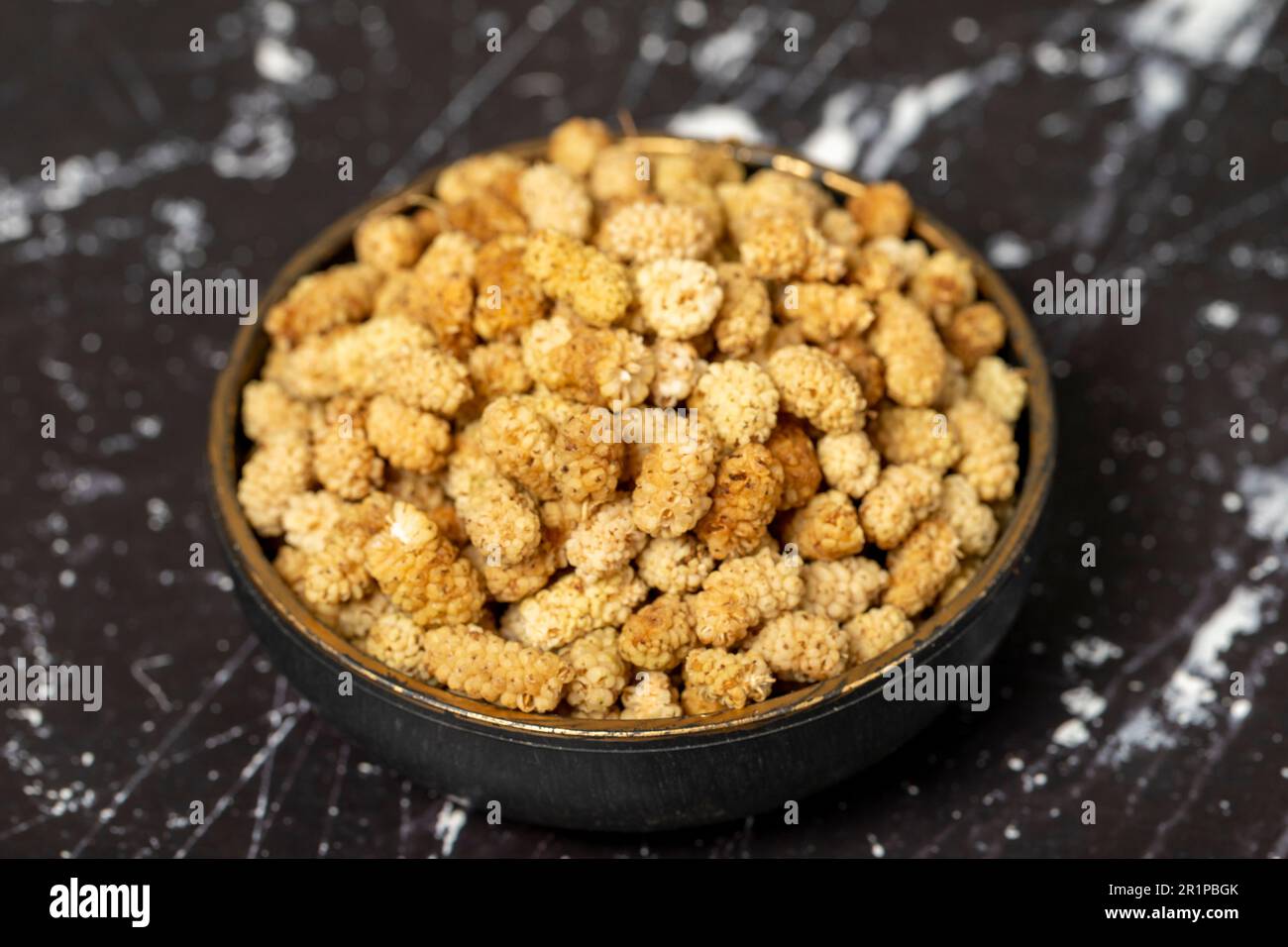 Dried mulberry. Sun-dried organic white dried mulberry in bowl ...