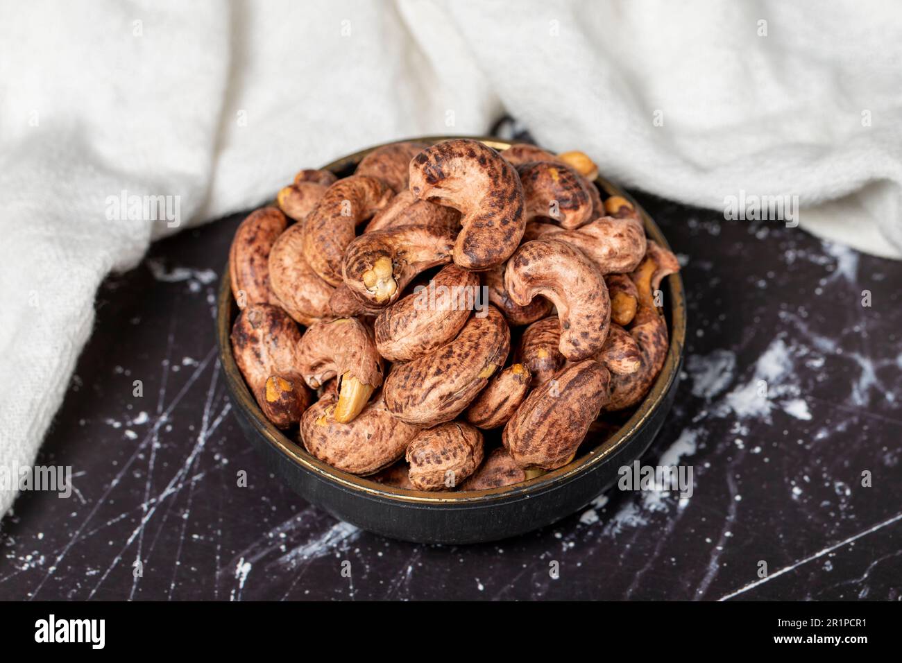 Cashew nuts . Roasted cashew nuts with shell in bowl. Superfood ...