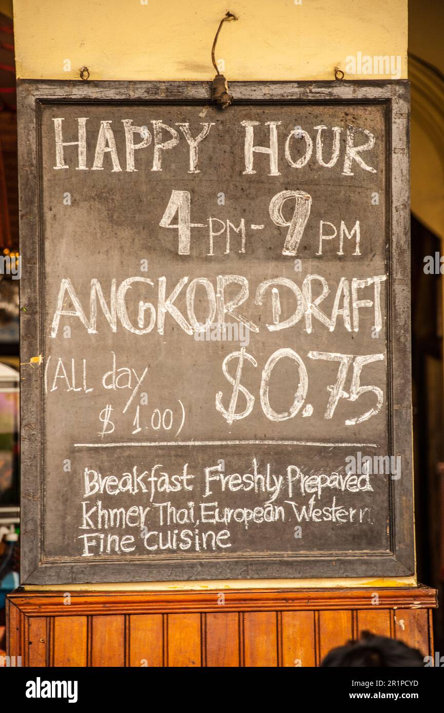 Handwritten "Happy Hour" sign advertising Angkor draft beer on the ...