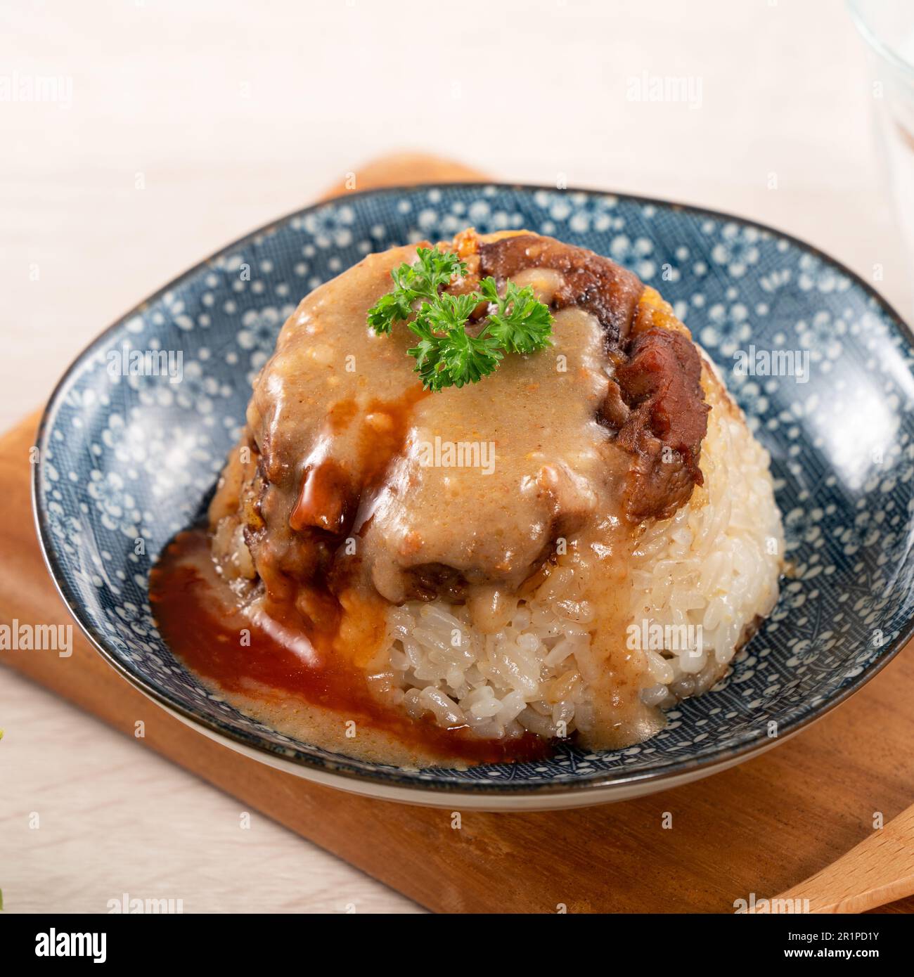 Migao, tube rice cake, rice pudding in a bowl topped with minced pork ...