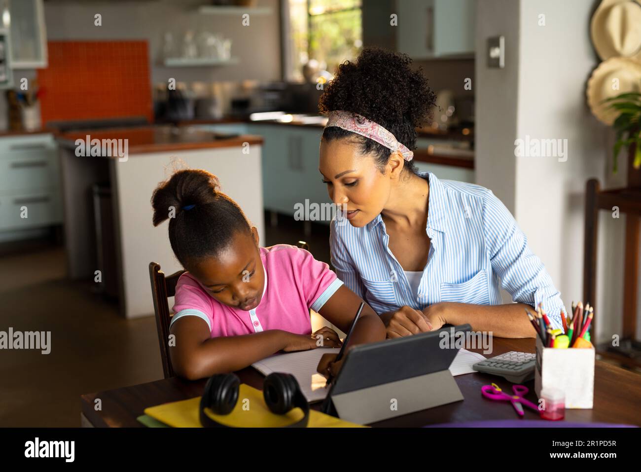 Little daughter using tablet computer hi-res stock photography and ...